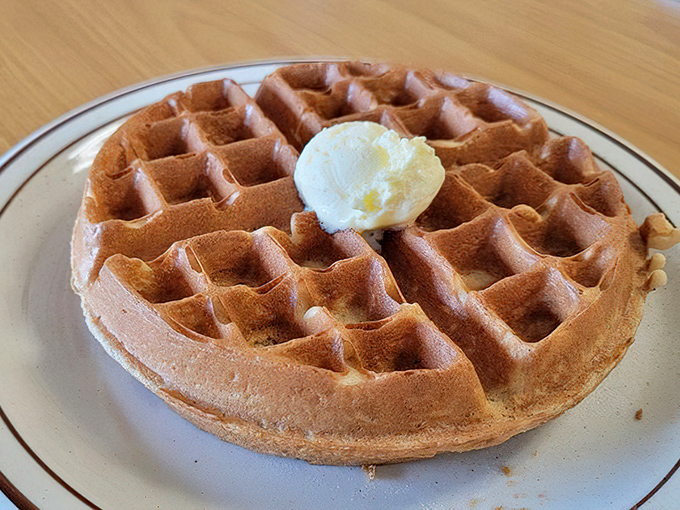 This Belgian waffle doesn't need fancy toppings to impress &ndash; just a perfect golden crust, tender interior, and a dollop of butter slowly melting into those squares.
