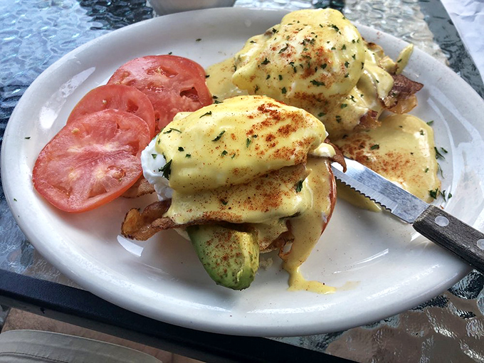 This Benedict variation transforms classic brunch into an Instagram-worthy masterpiece of golden hollandaise perfection.
