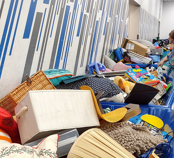 Household treasures mingle with clothing in organized chaos that somehow makes perfect shopping sense.