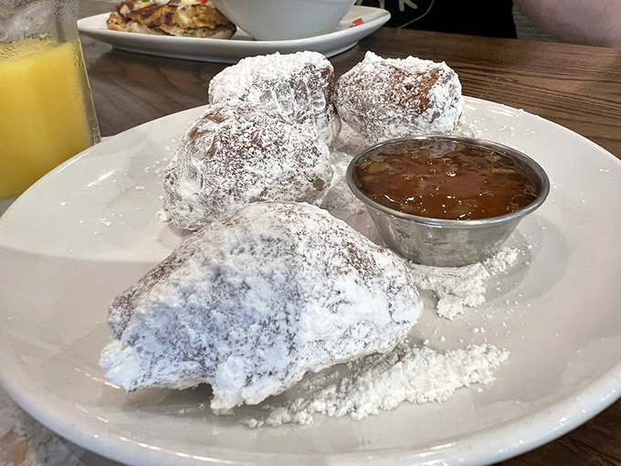 Biscuit beignets dusted with powdered sugar bliss. Like New Orleans took a vacation to the South and decided to stay for breakfast.