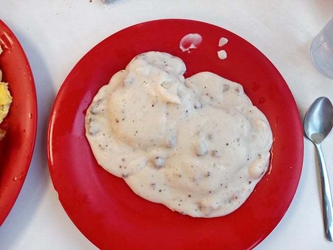 Biscuits and gravy so authentic they should come with their own Southern accent. That pepper-speckled cream gravy blankets everything in velvety comfort.