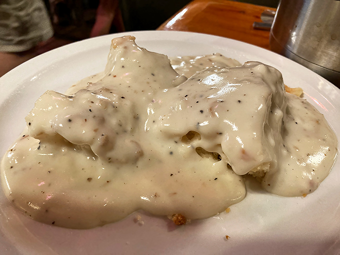 Biscuits swimming in creamy, pepper-flecked gravy. The kind of dish that makes you want to hug the chef and adopt their family.
