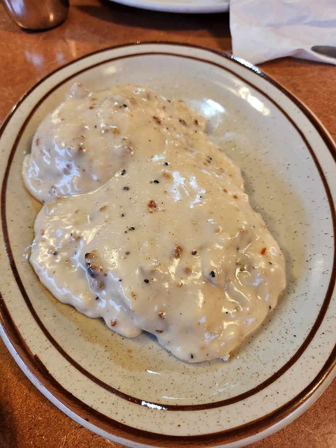 Country gravy cascading over fresh-made biscuits&mdash;a Southern hug on a plate that makes you understand why some food memories last forever.