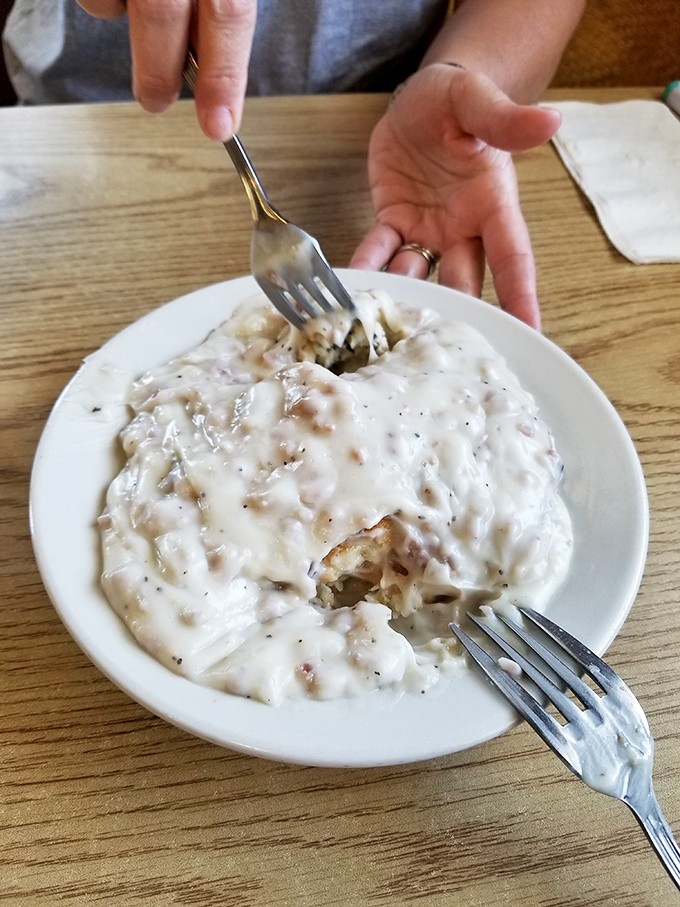 Biscuits and gravy so rich and comforting, it's like getting a warm hug from your favorite grandma who never skimped on the good stuff.