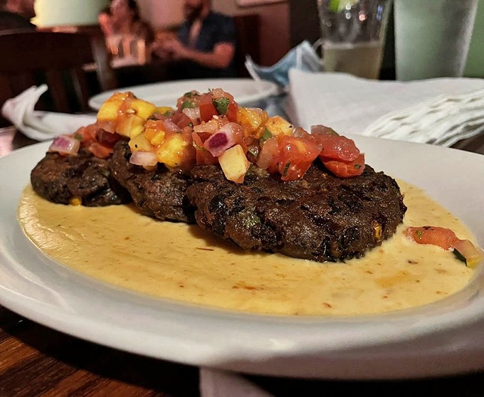 Black bean cakes topped with vibrant mango salsa &ndash; proof that vegetarian dishes can make even dedicated carnivores forget to ask, "Where's the beef?"