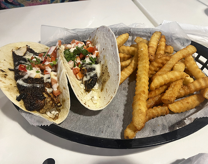 Blackened mahi tacos that make you question every other fish taco you've ever committed to memory. The crinkle-cut fries are just showing off.