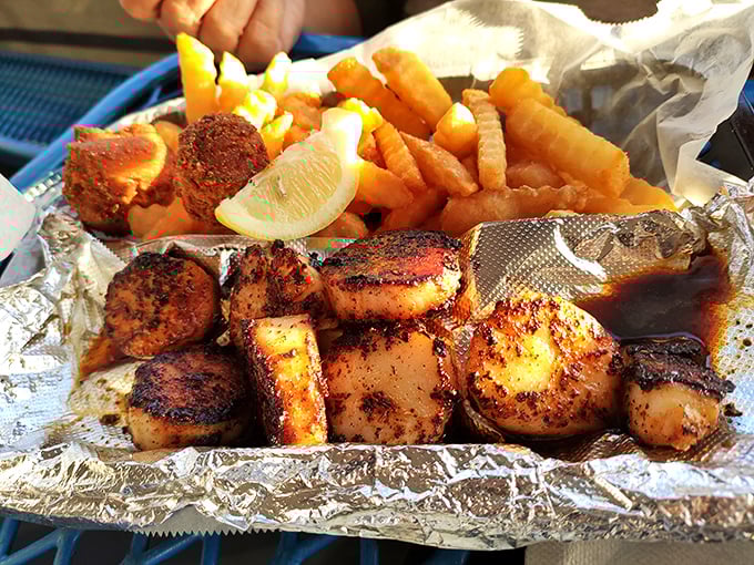 Blackened scallops that would make Neptune himself weep with joy. The char marks are like flavor autographs from the sea gods.
