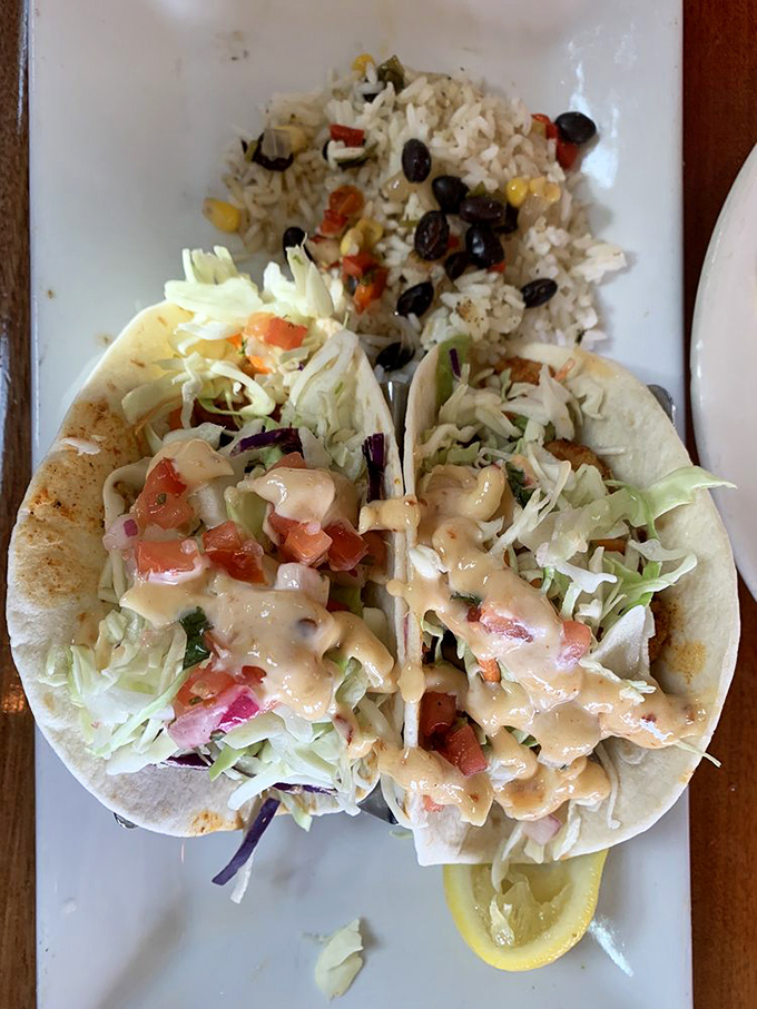 Two tacos that could start a religion. The blackened seasoning creates a spice symphony while the sauce cools things down just right.