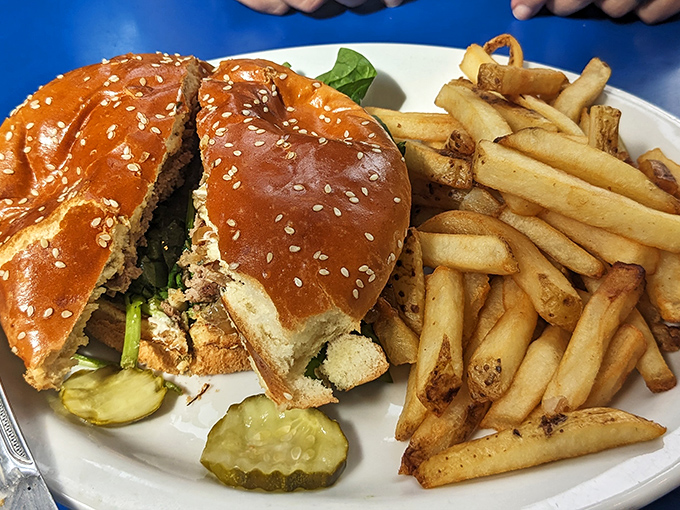 This burger isn't messing around—sesame-studded bun, perfectly proportioned, with fries that look hand-cut and properly crisp.