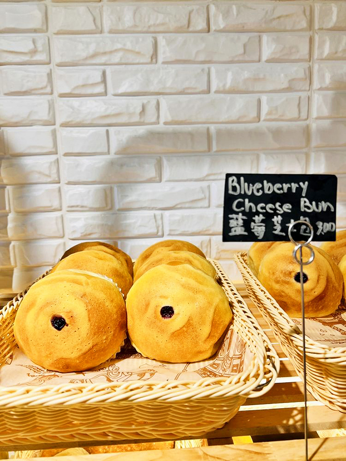Golden-brown blueberry cheese buns with their telltale purple centers are what would happen if a Danish pastry went on vacation to Asia and came back transformed.