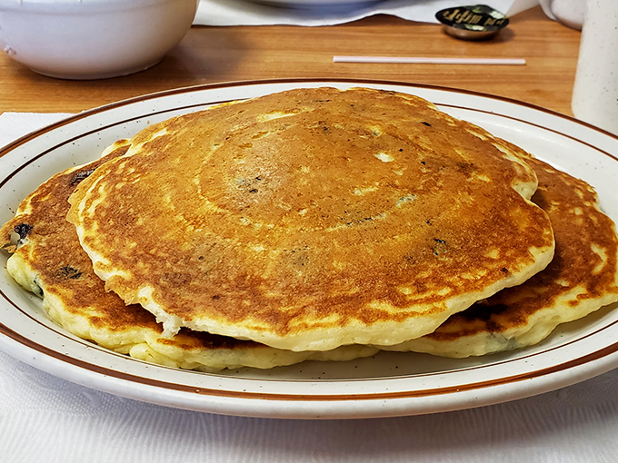 Golden-brown pancakes that look like they've been sunbathing to perfection. The kind that make you want to cancel your plans and order seconds.