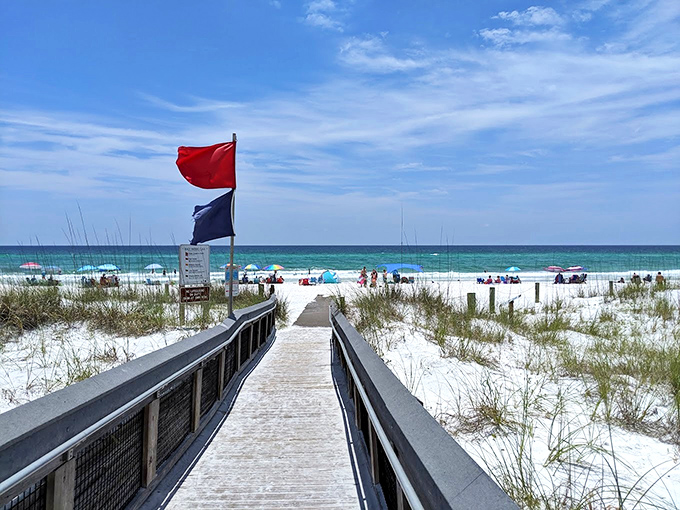 The boardwalk of dreams. That moment when the dunes part, flags flutter, and the Gulf reveals itself like the world's greatest curtain call.