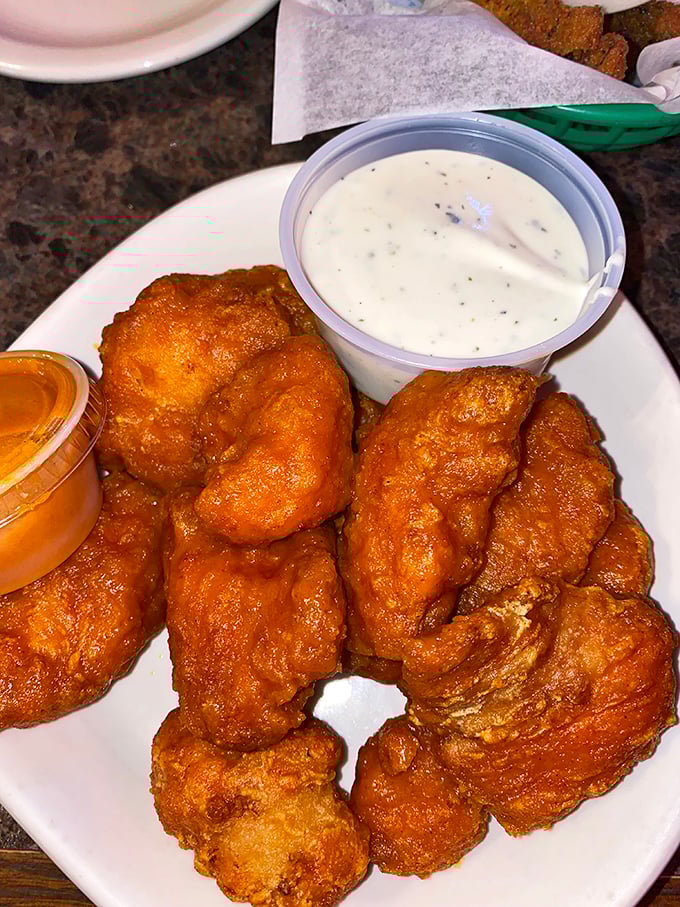 These golden-brown boneless wings aren't just fried&mdash;they're transformed into crunchy vessels of joy, waiting for their dipping sauce destiny.