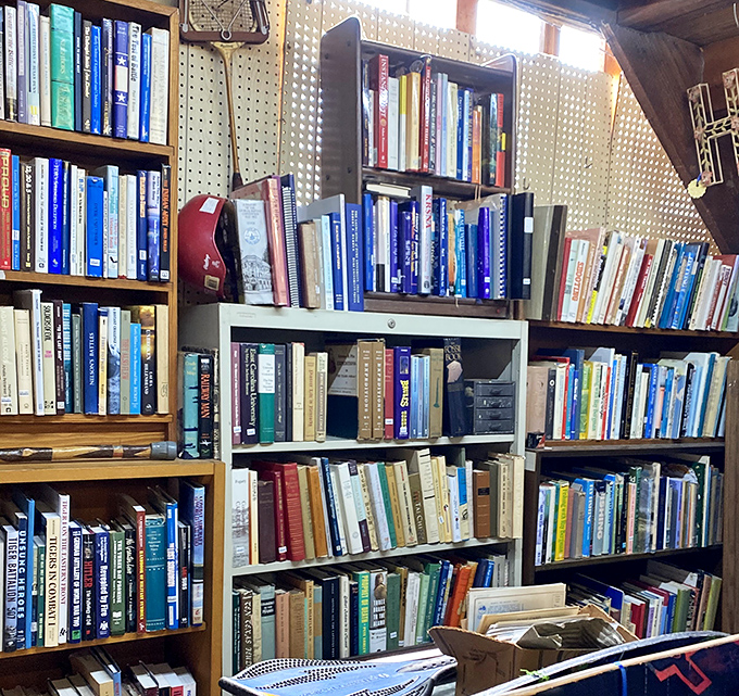 Books upon books&mdash;each shelf a different rabbit hole of knowledge. That red bookend is practically begging you to build a home library worthy of a British mystery.