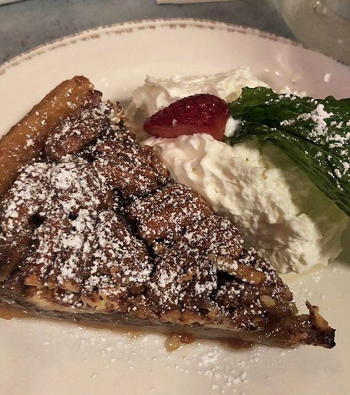 This isn't just pecan pie &ndash; it's Southern comfort wrapped in a flaky crust with a side of nostalgia that'll make you call your grandmother.