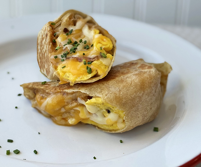 Breakfast burritos here aren't just morning fuel&mdash;they're wrapped treasures of eggs, cheese and potential happiness, garnished with fresh chives.
