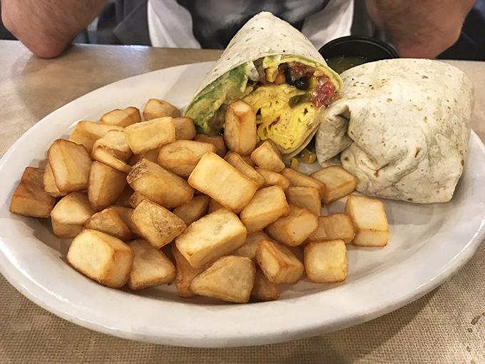 This breakfast burrito with perfectly crisp home fries isn't just a meal, it's edible architecture with flavor in every foundation.