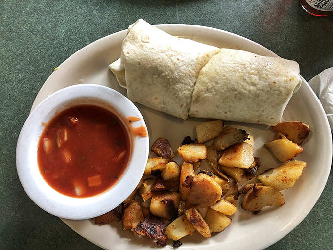 Breakfast goes portable with this hearty wrap accompanied by home fries that achieve the golden-brown perfection we all aspire to in life.