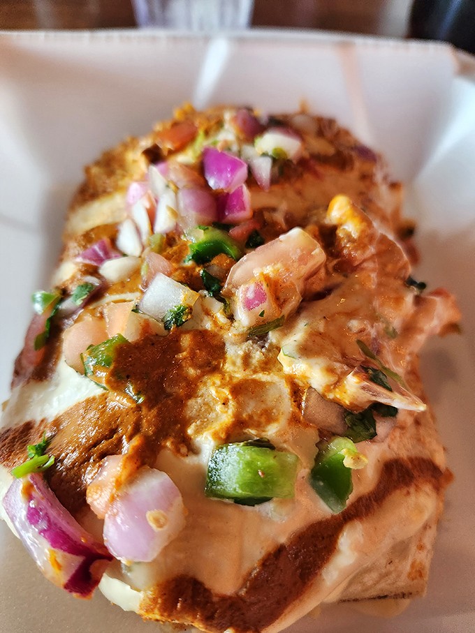 A breakfast burrito so loaded, it needs its own zip code and possibly structural engineering degree.