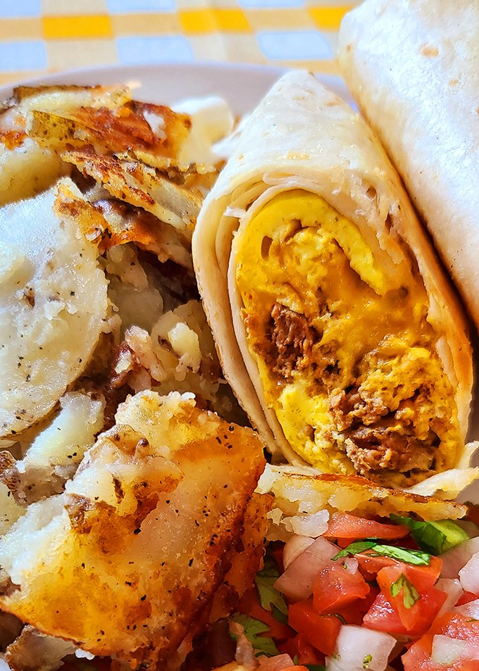 This breakfast burrito isn't just a meal, it's an edible masterpiece stuffed with eggs, meat, and morning happiness.