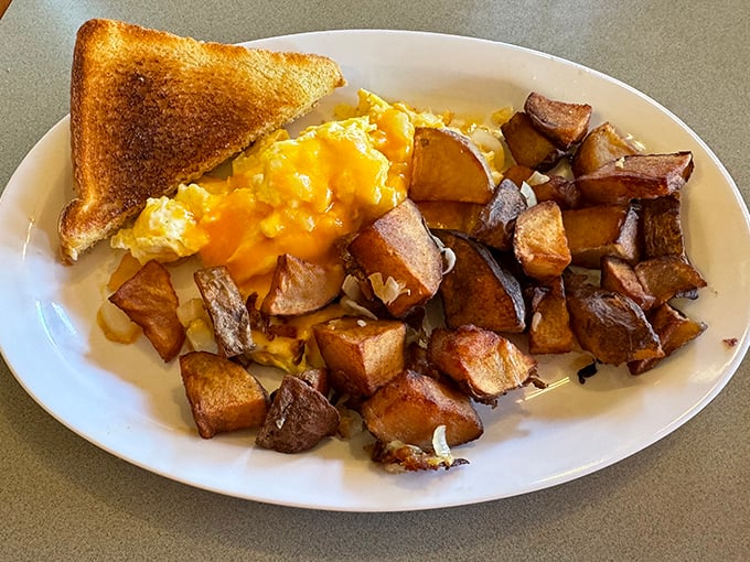 Golden potatoes crisped to perfection alongside eggs that remind you why breakfast might actually be the superior meal.