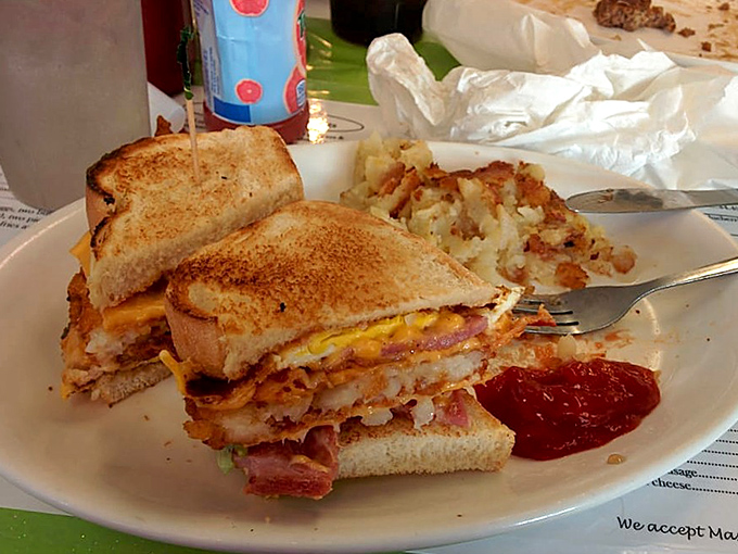 This isn't just a sandwich&mdash;it's an architectural marvel of toasted bread, melted cheese, and savory meats that demands both hands and napkins.