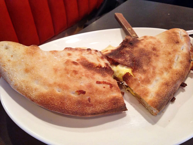 Breakfast stromboli: where pizza meets morning. This golden pocket of cheese and breakfast ingredients makes hitting snooze seem like a terrible mistake.