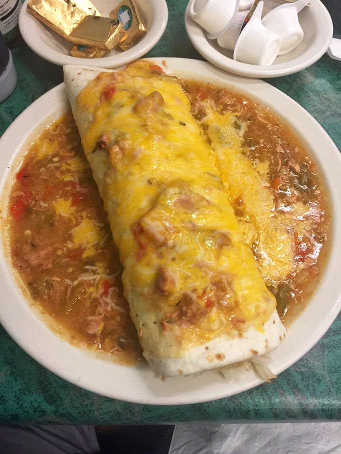 This breakfast burrito isn't just food; it's a Denver tradition wrapped in a tortilla and smothered in enough green chili to jumpstart your day.