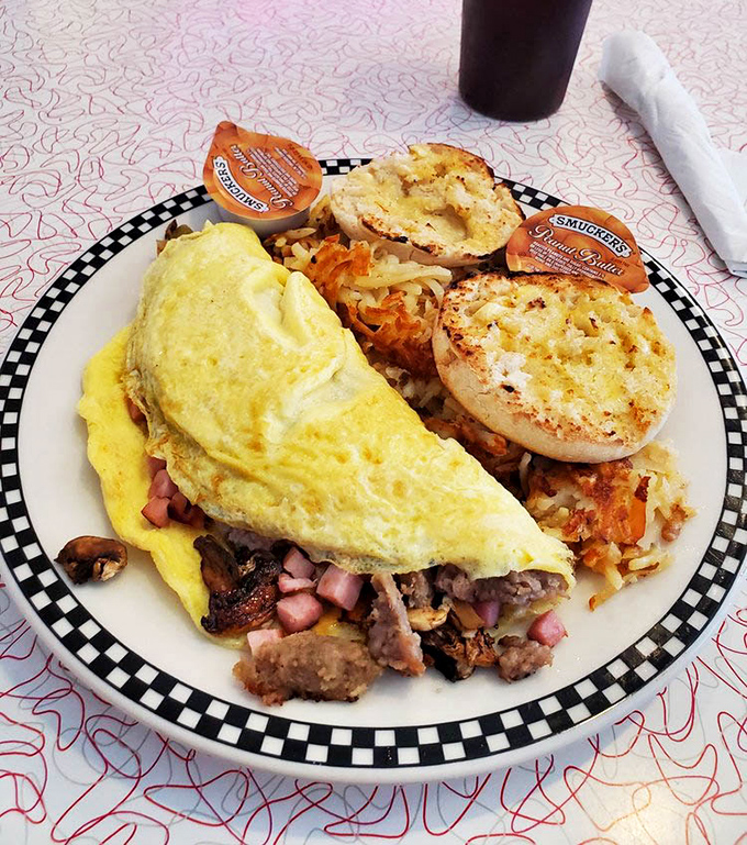 This isn't just breakfast&mdash;it's morning therapy. A perfect omelet with a side of golden hash browns and buttery English muffins that make hitting the snooze button worth it.