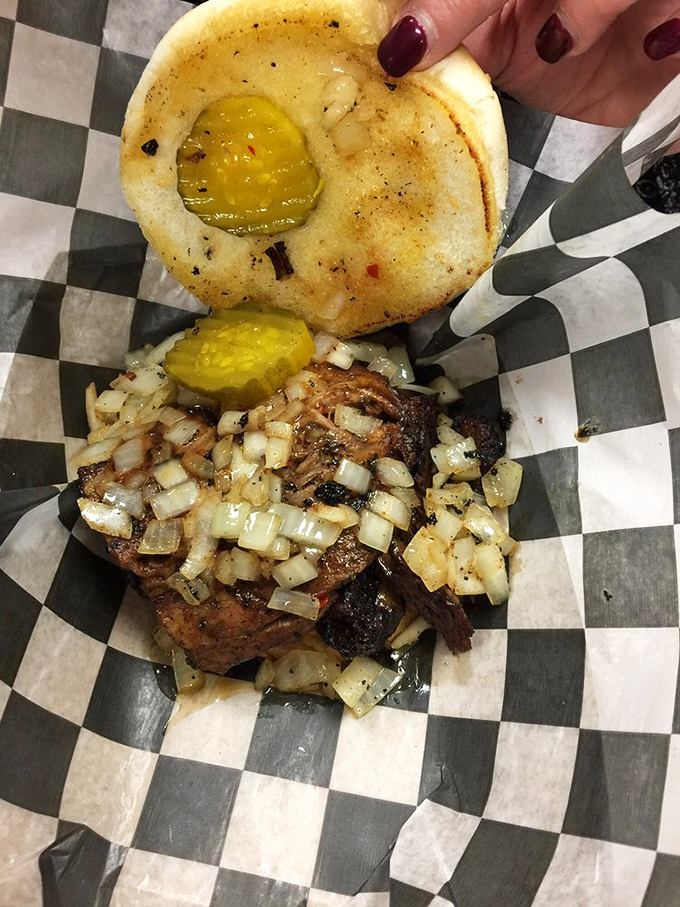 Brisket so tender it practically surrenders at the sight of a fork, paired with pickles that provide the perfect tangy counterpoint.