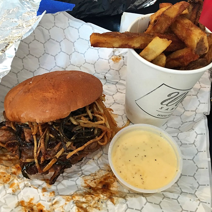 That brisket sandwich looks like it went to finishing school and graduated with honors in deliciousness.