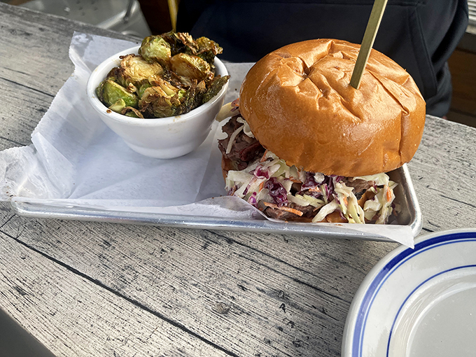 A proper brisket sandwich should require both hands and several napkins. This one, with its mountain of slaw, checks all the right boxes.