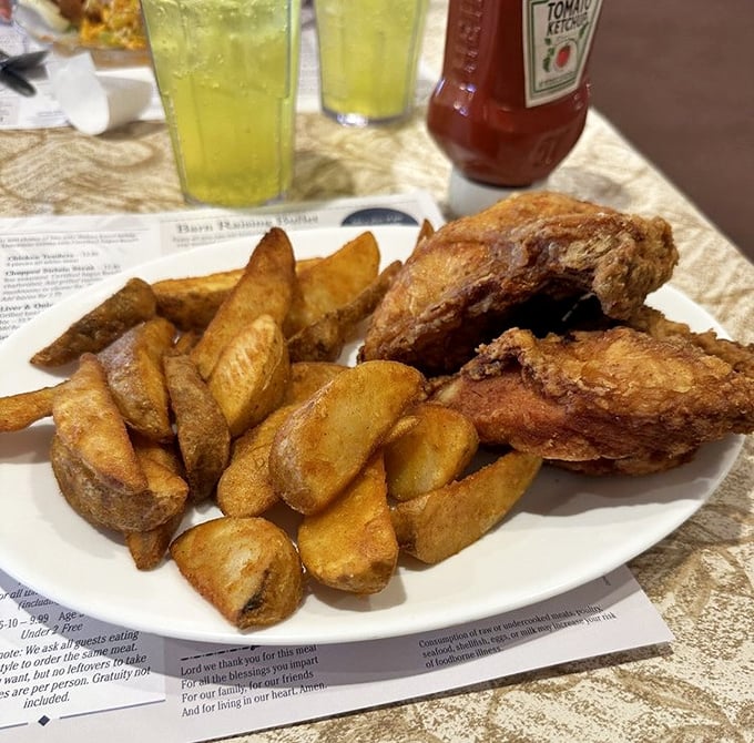 Crispy potato wedges flank broasted chicken with skin so perfectly crackling, it makes other fried chicken question its life choices.