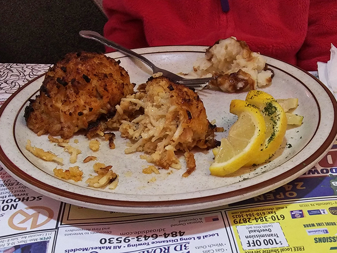 Crab cakes that look like they're auditioning for a seafood calendar&mdash;bronzed, plump, and ready for their close-up with those lemon wedges.