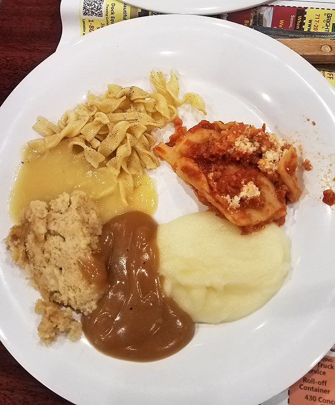 Comfort on a plate: buttery noodles, homestyle gravy, and that perfect scoop of mashed potatoes that's somehow both fluffy and substantial.