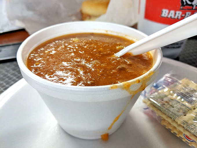 This Brunswick stew isn't just a side dish – it's a complex, tomato-based masterpiece that's earned its place as co-star on the restaurant's marquee.