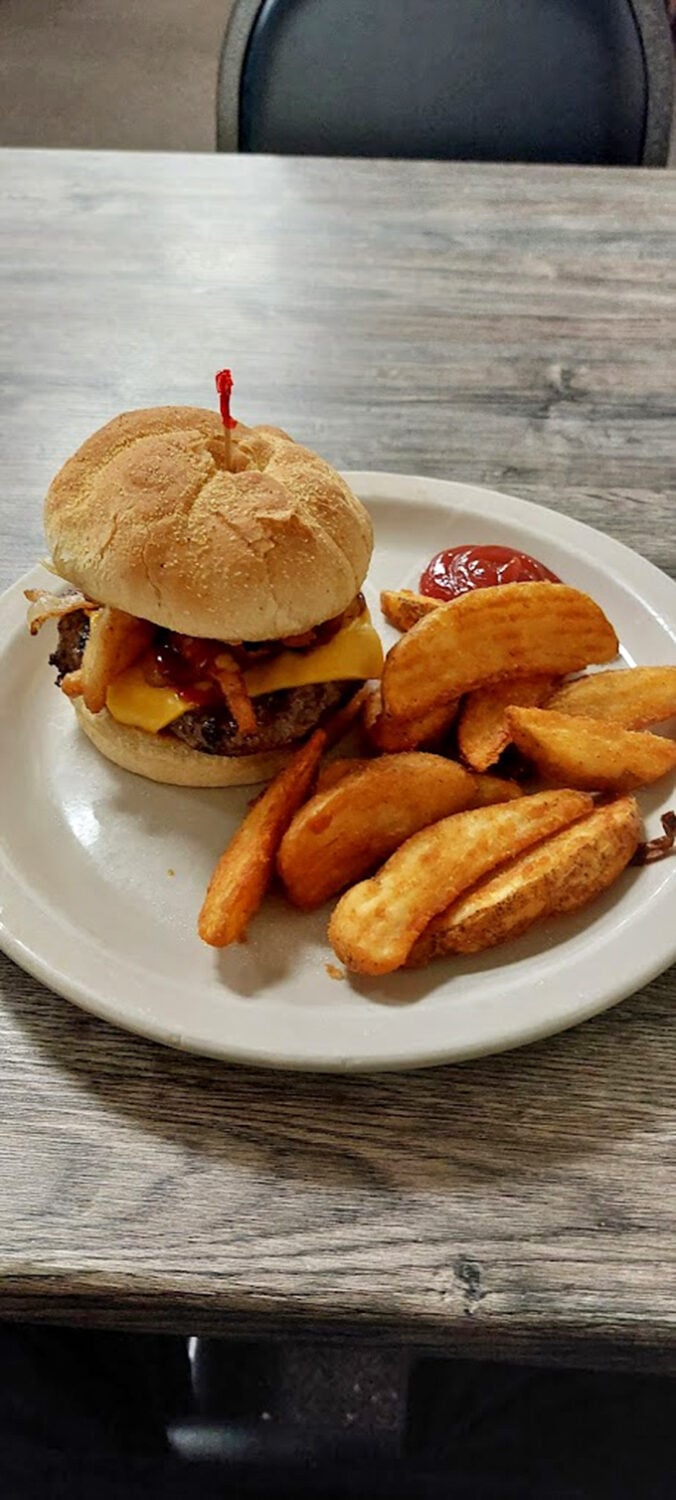 This isn't just a burger &ndash; it's edible architecture. The golden-brown bun, melty cheese, and perfectly cooked patty form a holy trinity of satisfaction.
