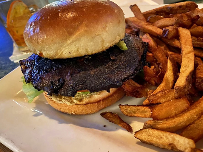 This isn't just a burger; it's a masterclass in simplicity &ndash; perfectly charred, nestled on a pillowy bun with hand-cut fries that deserve their own fan club.