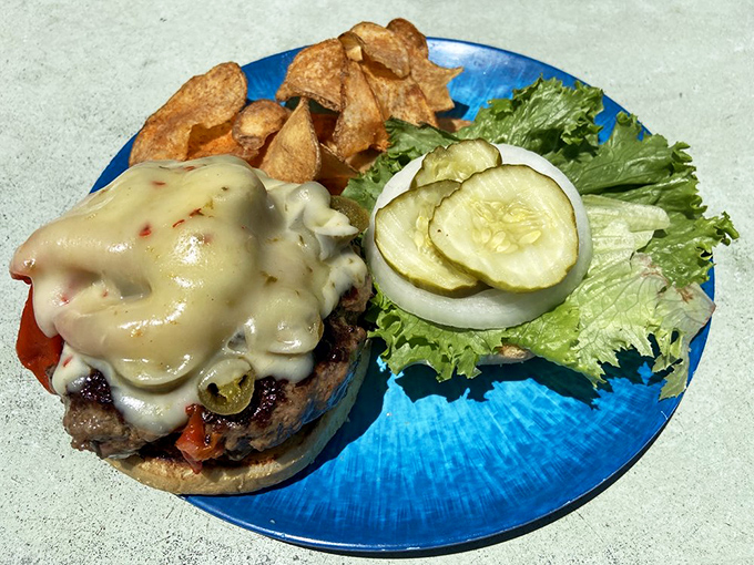 This isn't just a burger; it's a masterclass in melty cheese, fresh toppings, and perfectly cooked beef that would make even seafood loyalists consider switching teams.