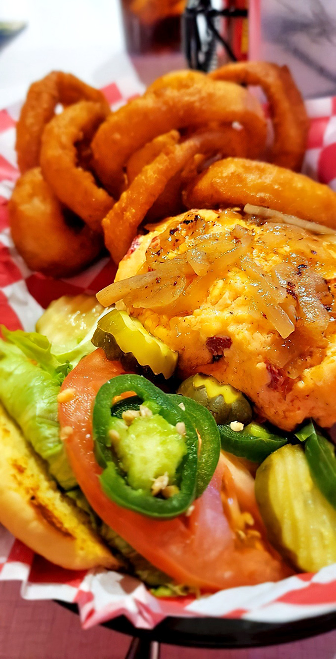 This isn't just a burger&mdash;it's architectural perfection. Golden onion rings stand guard while jalape&ntilde;os add just enough kick to wake up your taste buds.
