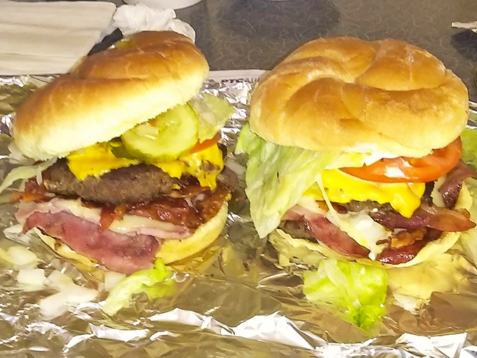 Architectural marvels of beef, bacon, and cheese that require strategic planning before the first bite. These burgers don't just satisfy hunger&mdash;they create food memories.