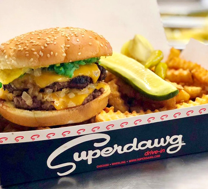 This isn't just a burger&mdash;it's a masterclass in American comfort food, complete with melty cheese, pickle sentinels, and fries that refuse to be mere sidekicks. 