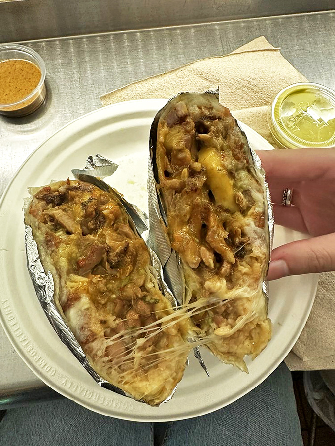 The burrito&mdash;a magnificent beast wrapped in foil, with cheese stretching like a suspension bridge between bites. Worth every napkin.