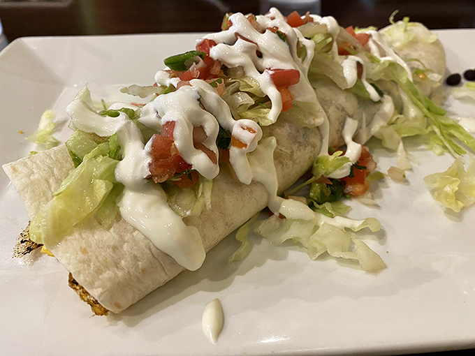 This isn't just any burrito &ndash; it's a masterpiece wrapped in white, dressed in green, and ready for its close-up.