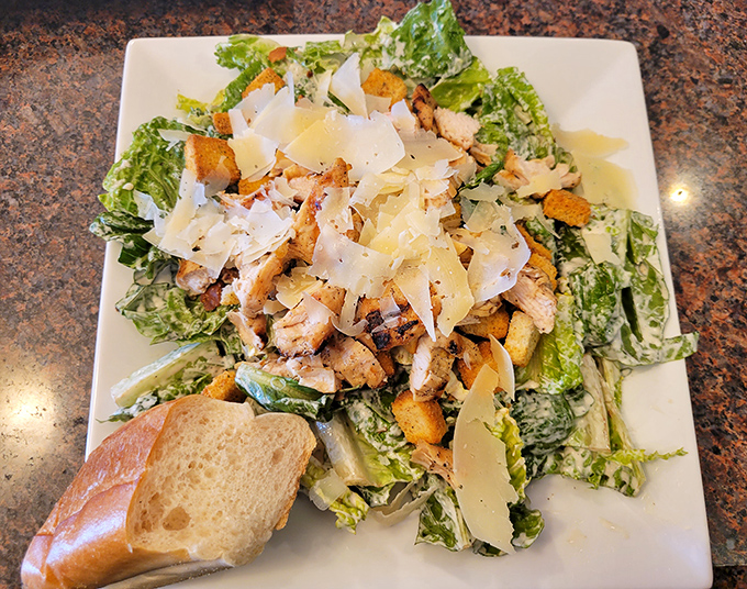 That Caesar salad comes loaded with grilled chicken, shaved parmesan, and croutons that actually have flavor and crunch.
