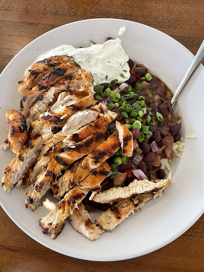 Blackened chicken perfection meets hearty black beans. This plate doesn't just satisfy hunger&mdash;it launches a flavor fiesta in your mouth.