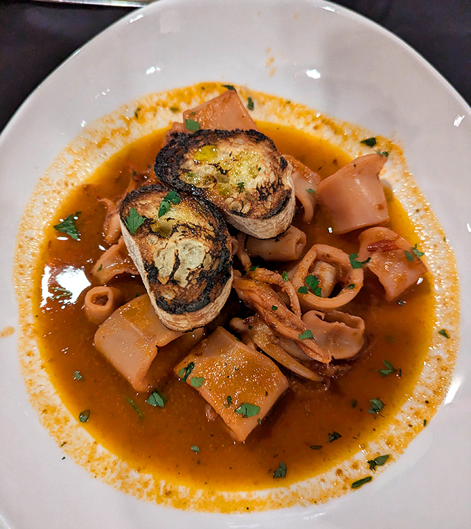 This seafood soup isn't just a starter; it's a maritime adventure with crusty bread boats ready to sail through that aromatic broth.