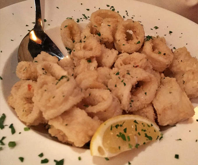 Calamari that defies the rubbery reputation of lesser versions &ndash; delicately fried, tender rings sprinkled with fresh herbs and waiting for a squeeze of lemon.
