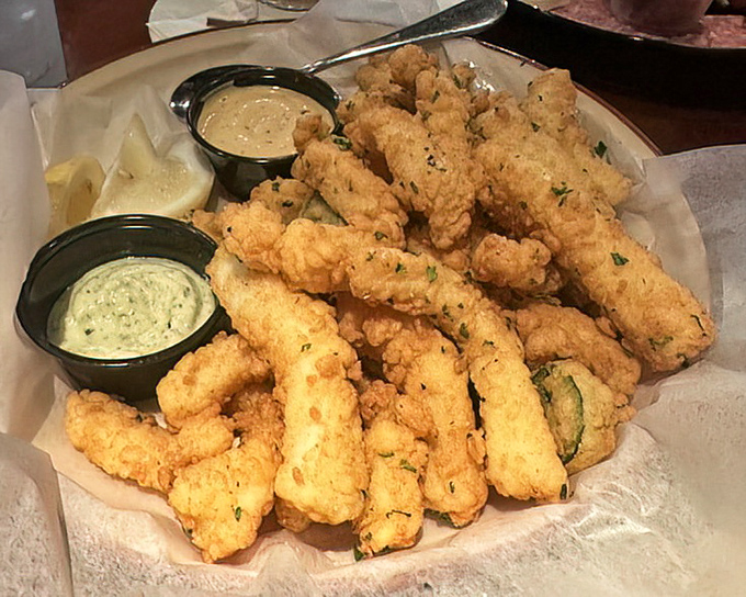 Golden-fried calamari that shatters with each bite. Two dipping sauces because sometimes life's too short to choose just one.
