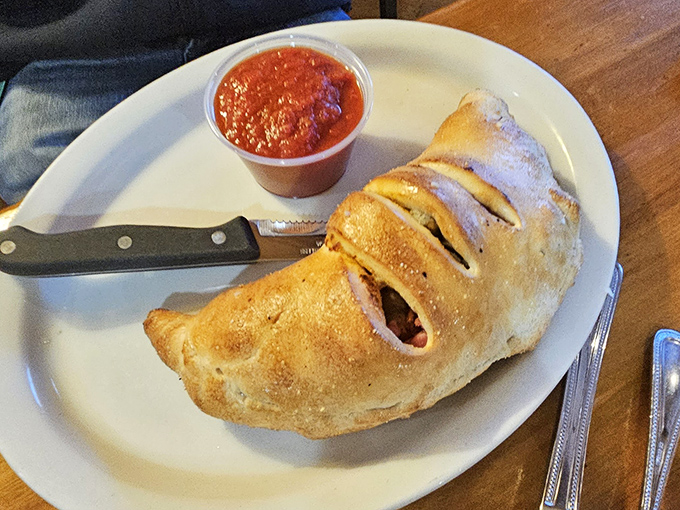 This calzone isn't just stuffed&mdash;it's having an existential crisis about containing so much deliciousness within its golden-brown, perfectly baked crust.